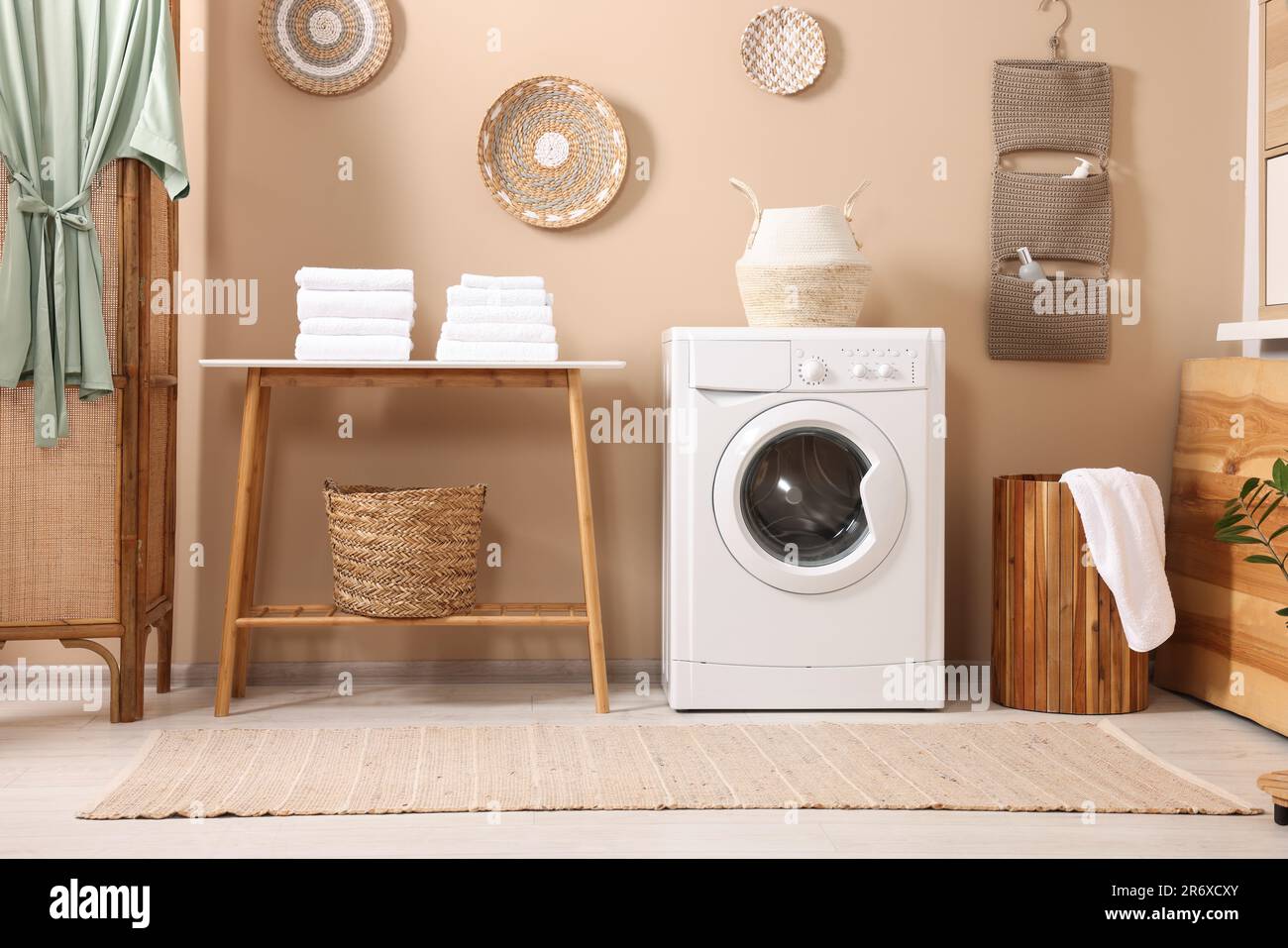 Stylish laundry room with modern washing machine. Interior design Stock ...