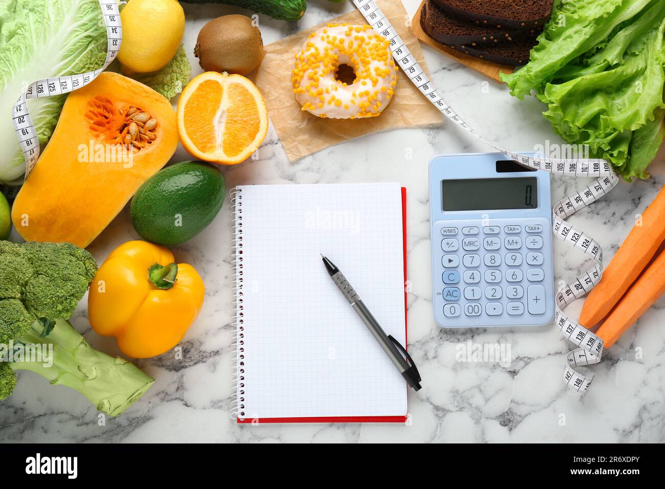 Food products, notebook with calculator on white marble table, flat lay ...