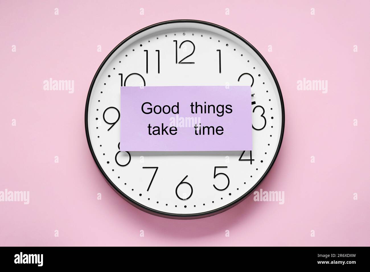 Card with phrase Good Things Take Time and clock on pink background ...