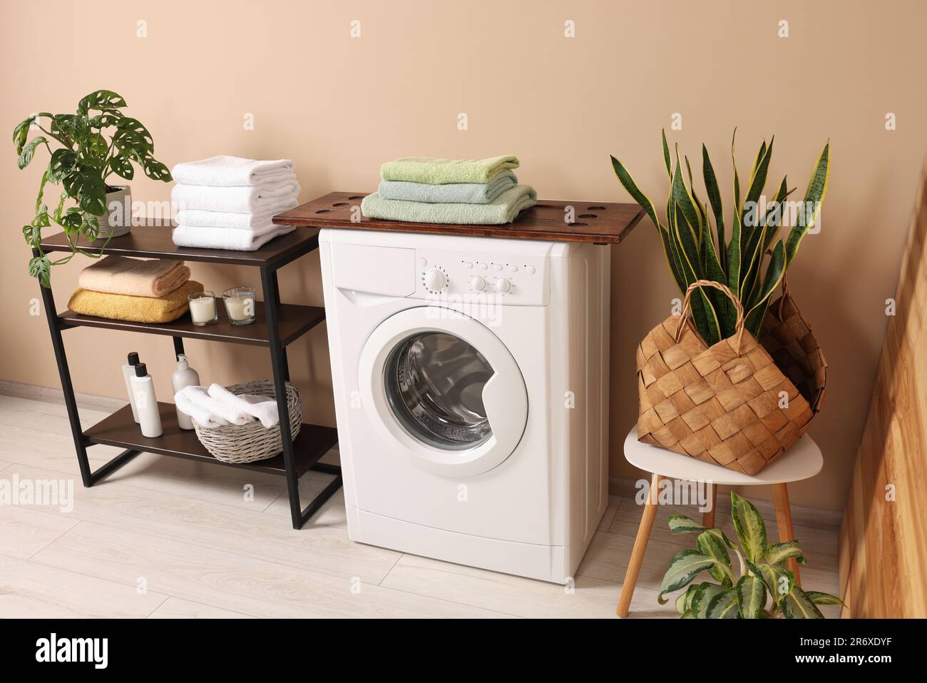 Stylish laundry room with modern washing machine. Interior design Stock ...