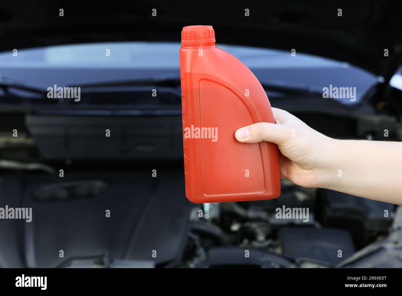 Auto mechanic holding bottle hi-res stock photography and images - Alamy