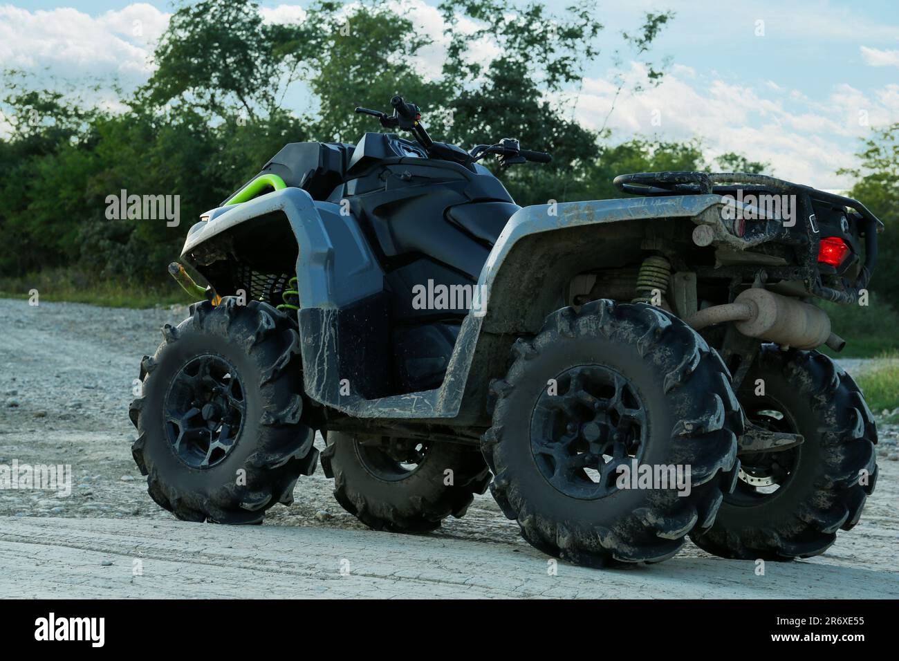 Modern fast quad bike on pathway outdoors Stock Photo - Alamy