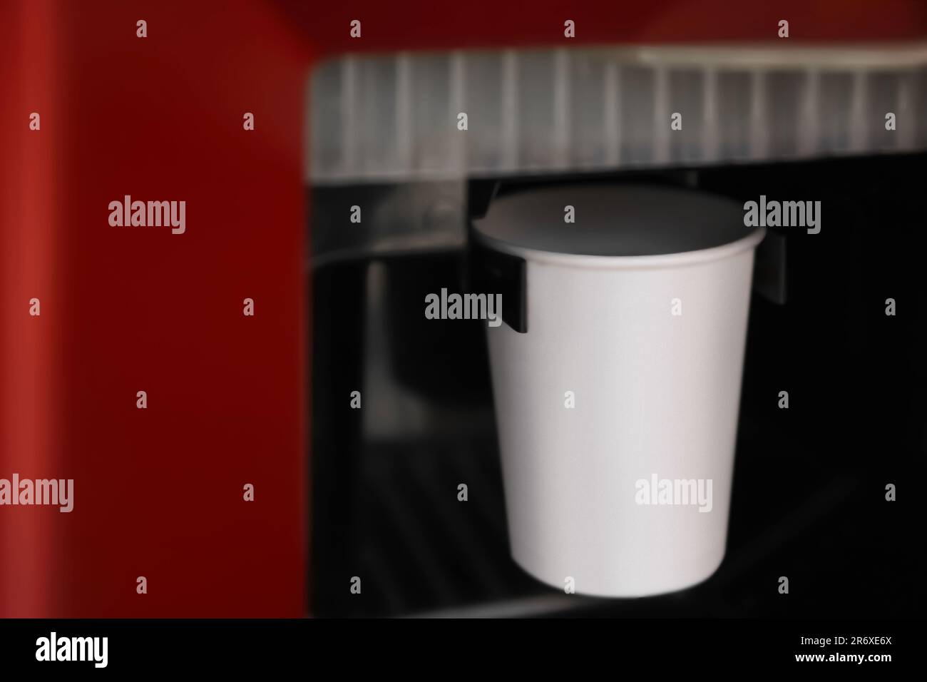 Paper cup with coffee in vending machine, closeup Stock Photo - Alamy