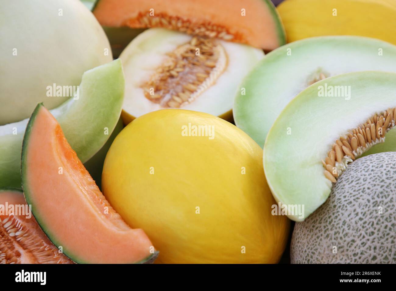 Different types of tasty ripe melons as background, closeup Stock Photo ...