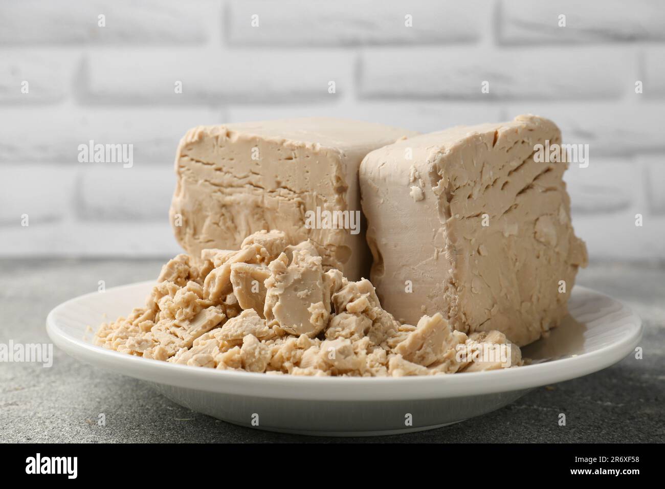 Closeup view of compressed yeast on grey table Stock Photo - Alamy