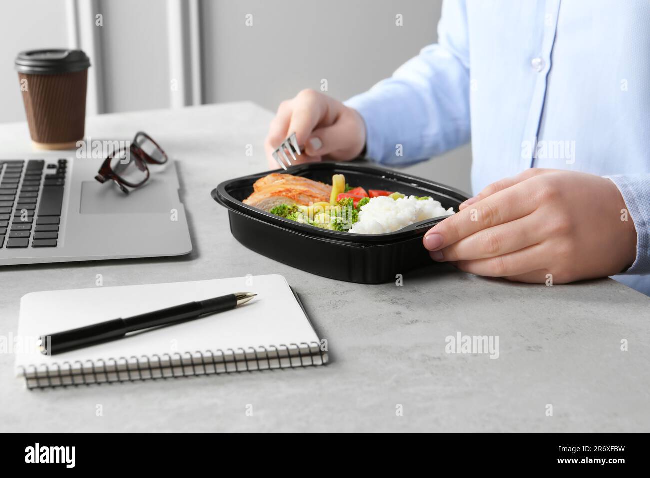 Office employee having business lunch at workplace, closeup Stock Photo ...