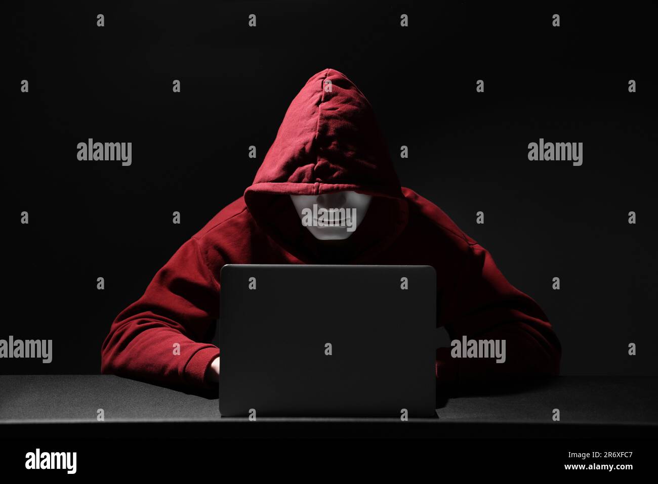 Hacker working with laptop in dark room. Cyber attack Stock Photo - Alamy