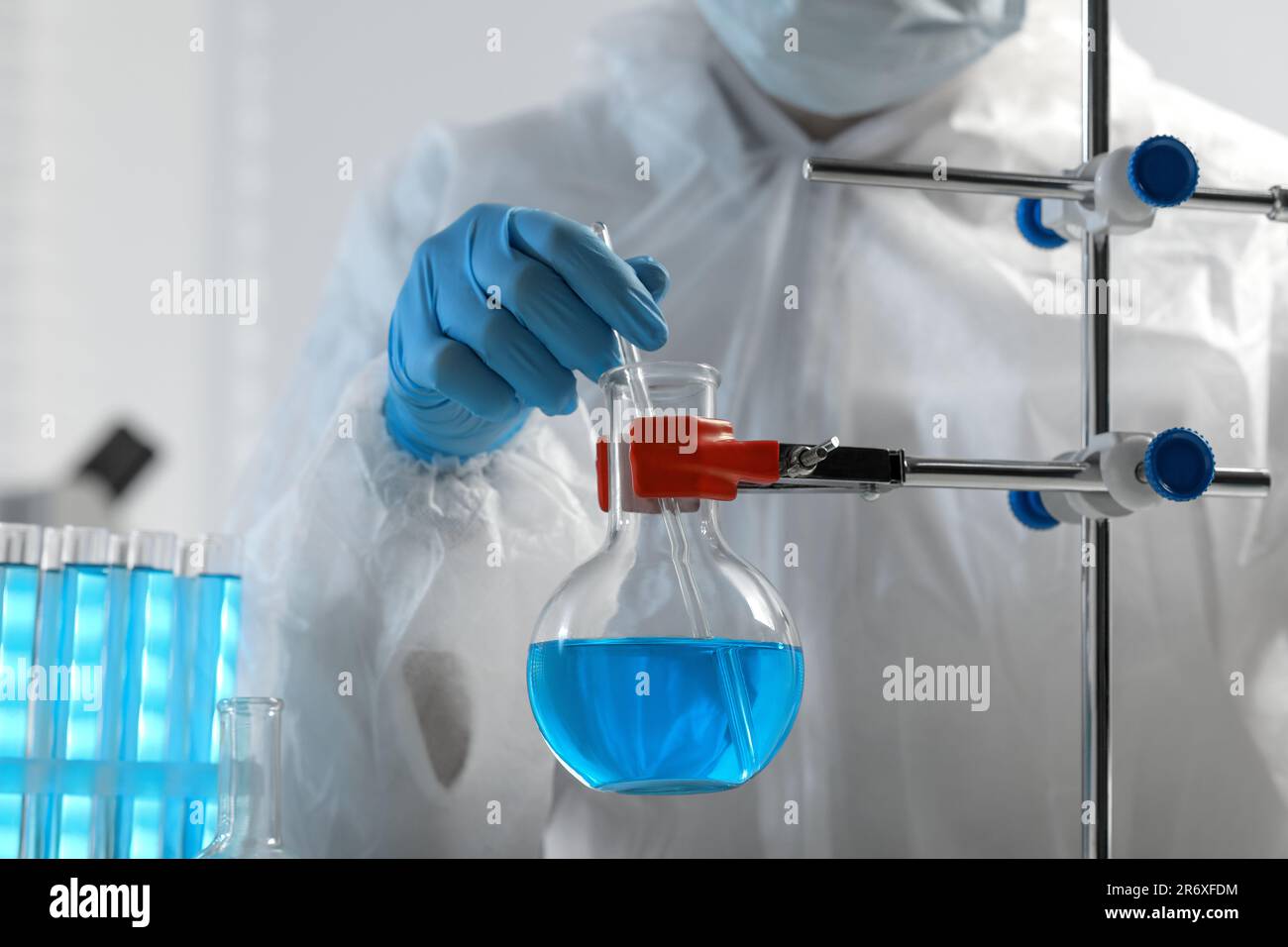 Scientist taking sample blue liquid hi-res stock photography and images ...