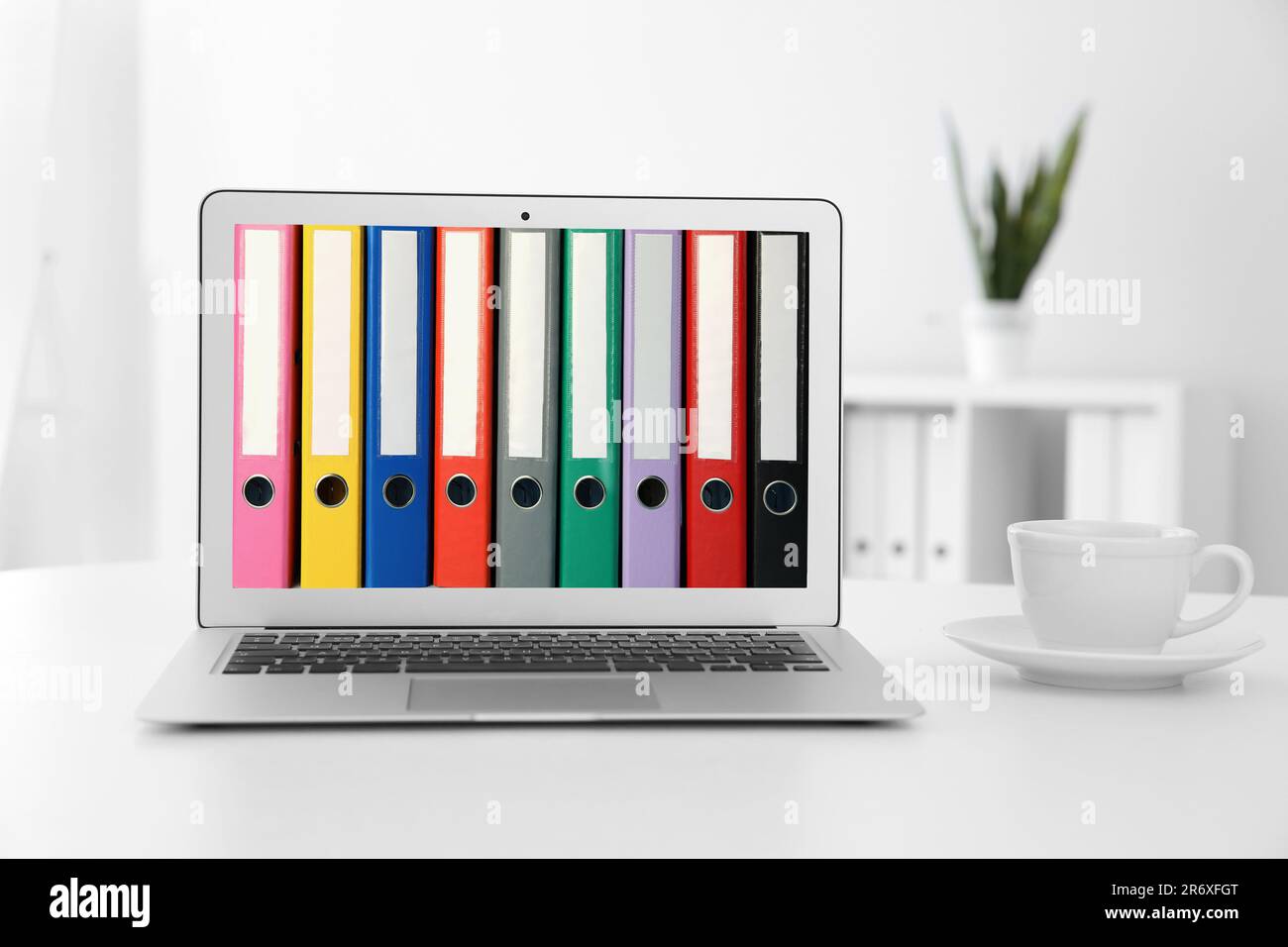 Store and organize information. Modern laptop with hardcover office ...