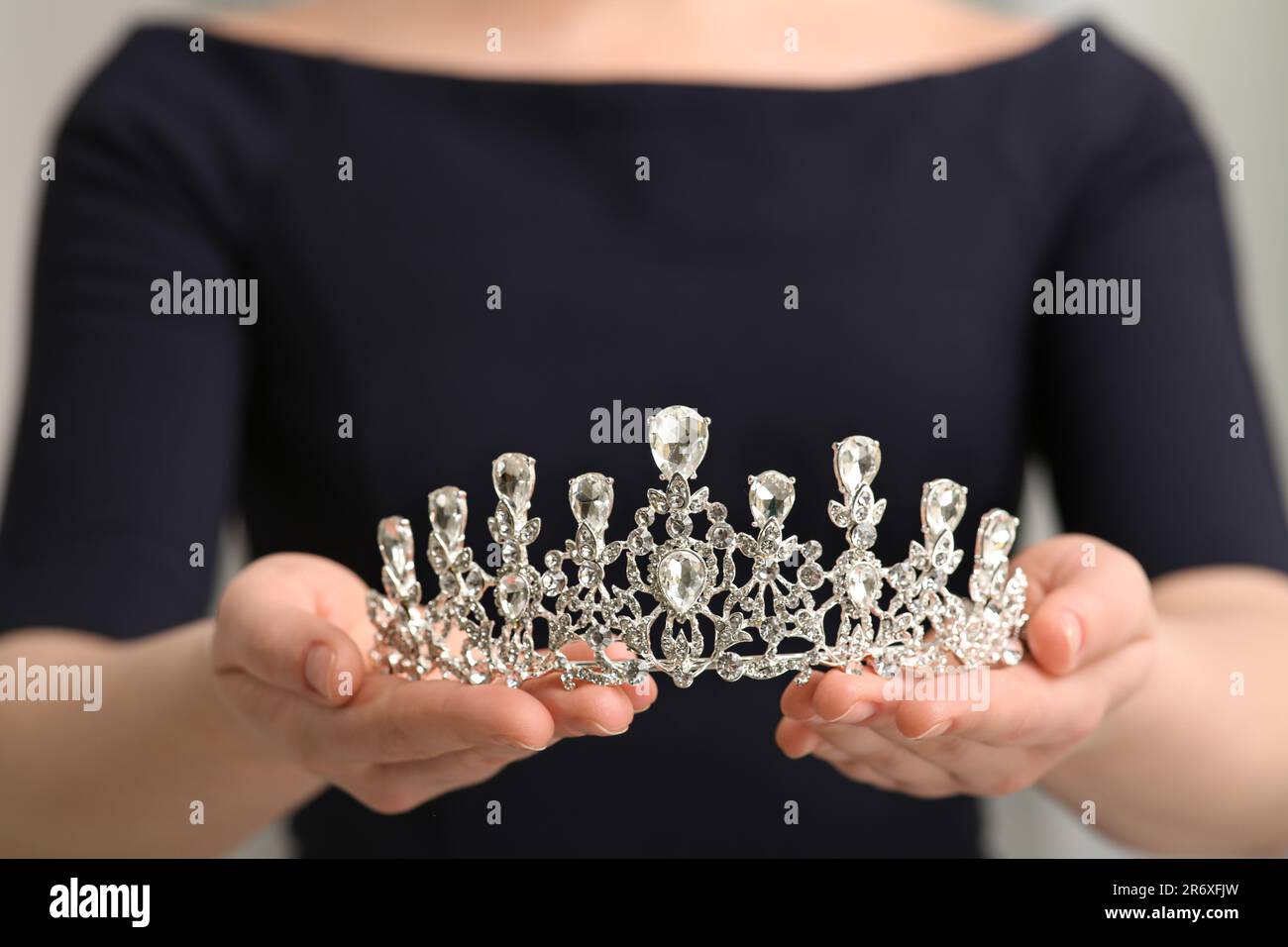Holding tiara hi-res stock photography and images - Alamy