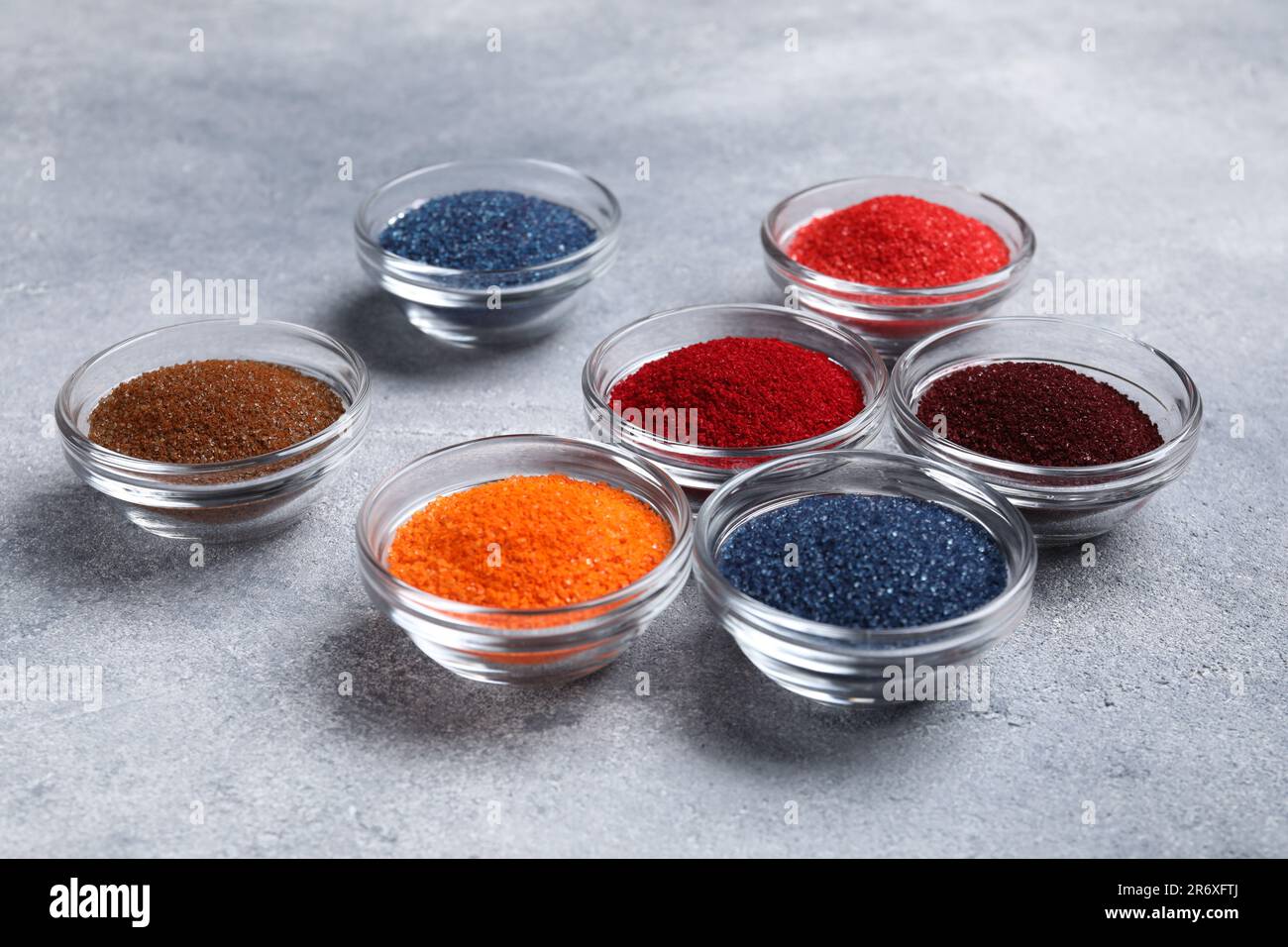 Different food coloring on light grey table Stock Photo - Alamy