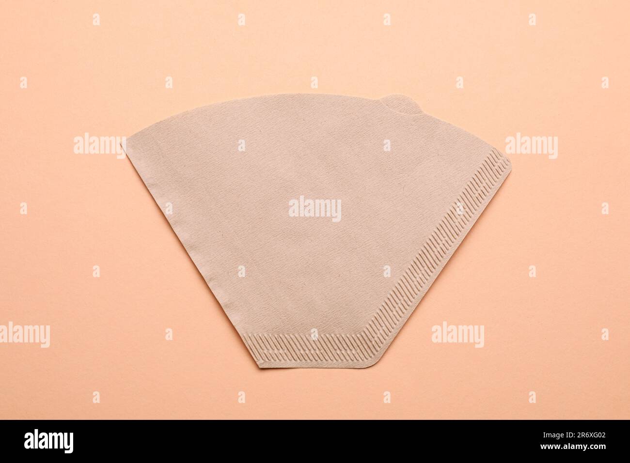 Paper coffee filter on beige background, top view Stock Photo - Alamy