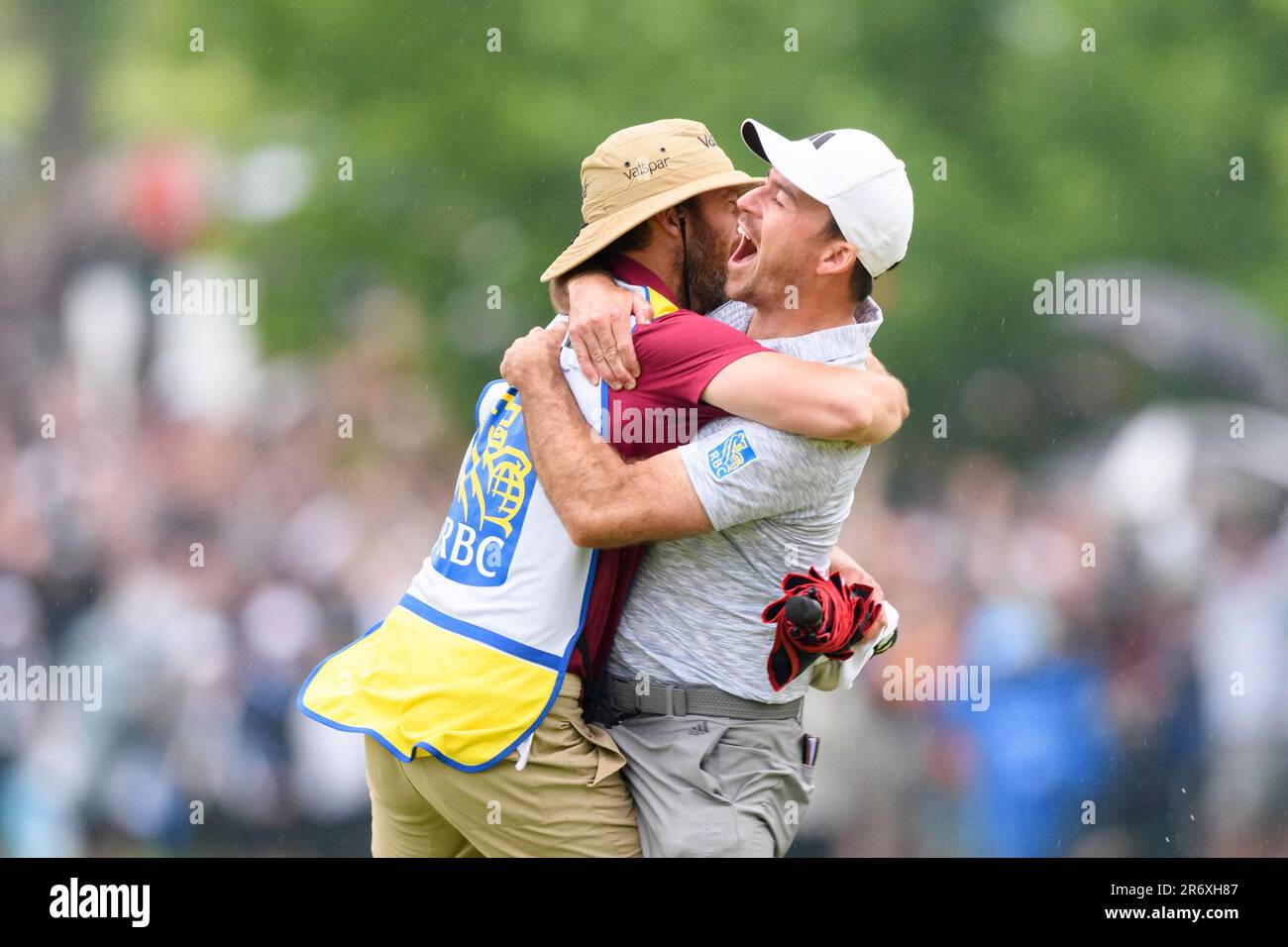 TORONTO, ON - JUNE 11: Nick Taylor of Canada celebrates with his caddie ...