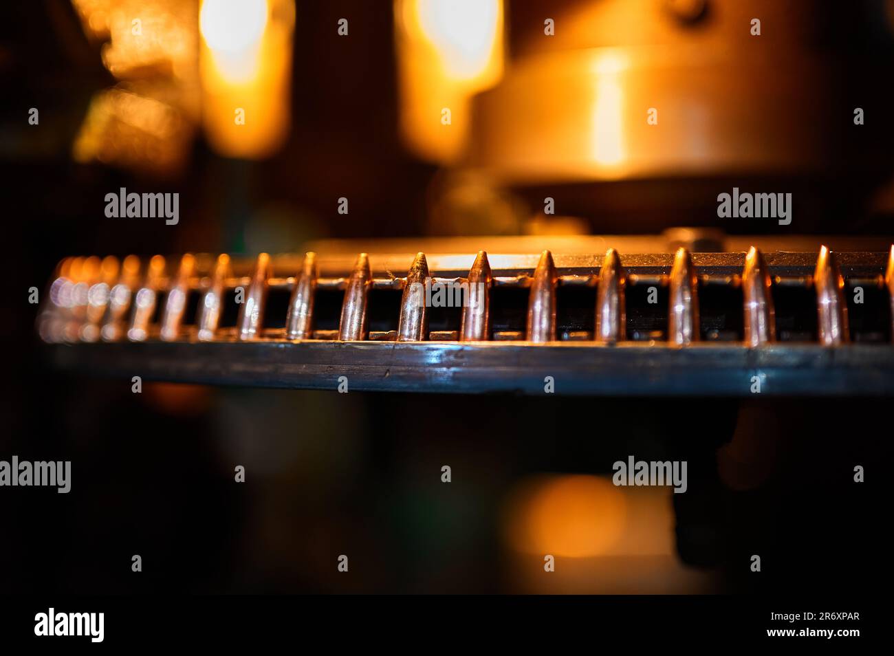 Copper bullets on production line part at weapon factory Stock Photo ...