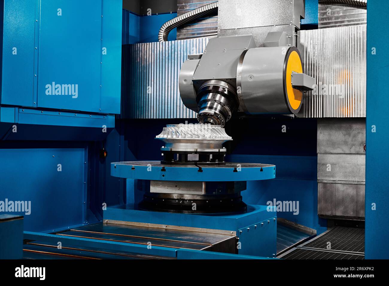 Five-axis milling machine makes turbine wheel at plant Stock Photo - Alamy