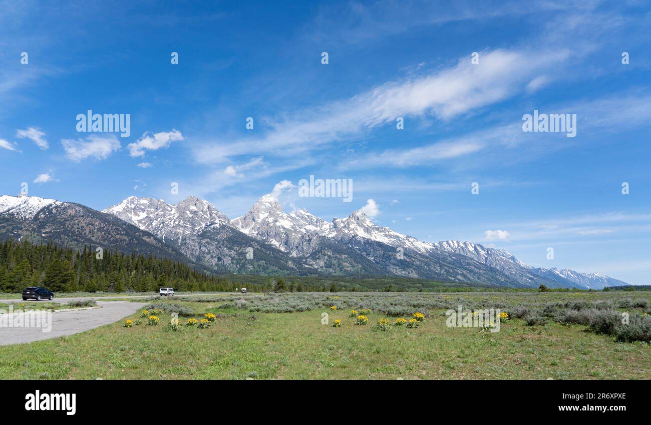 See the long road that runs below Grand Teton National Park in Wyoming ...