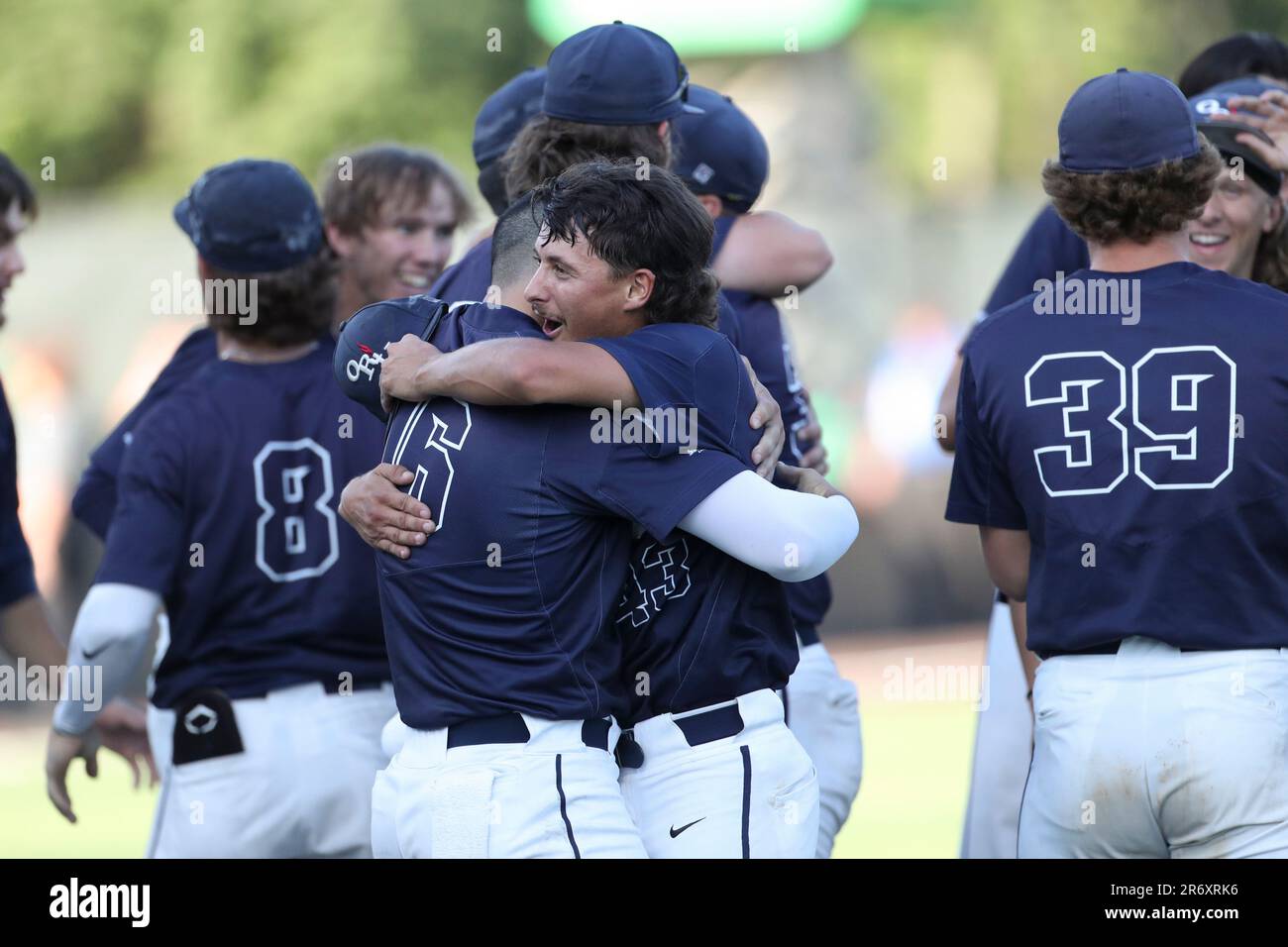 Oral Roberts' Ryan Blackwell, left, hugs Dalton Patten, right, while ...