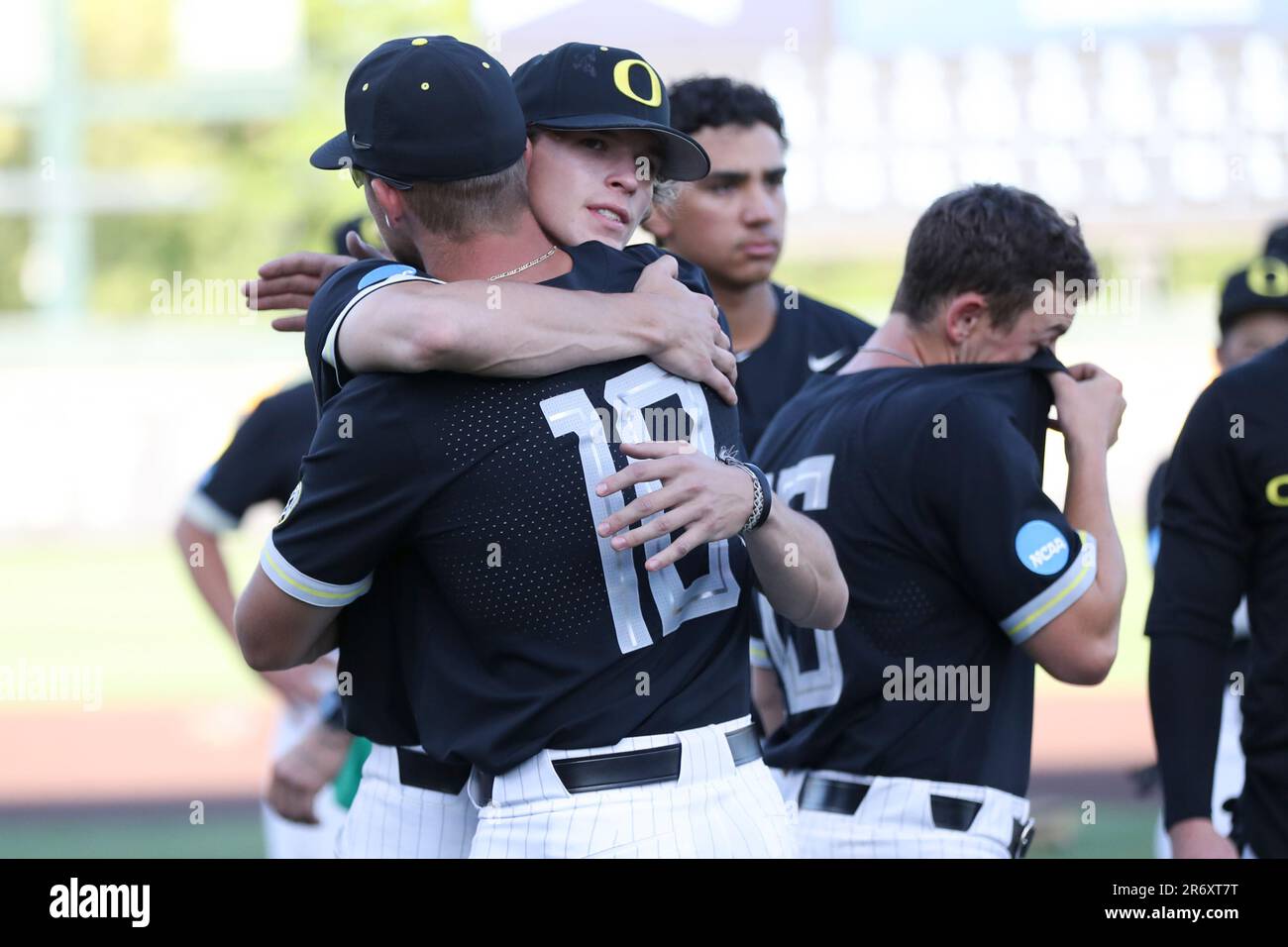 Oregon's Turner Spoljaric, right, hugs Owen Diodati, left, following ...