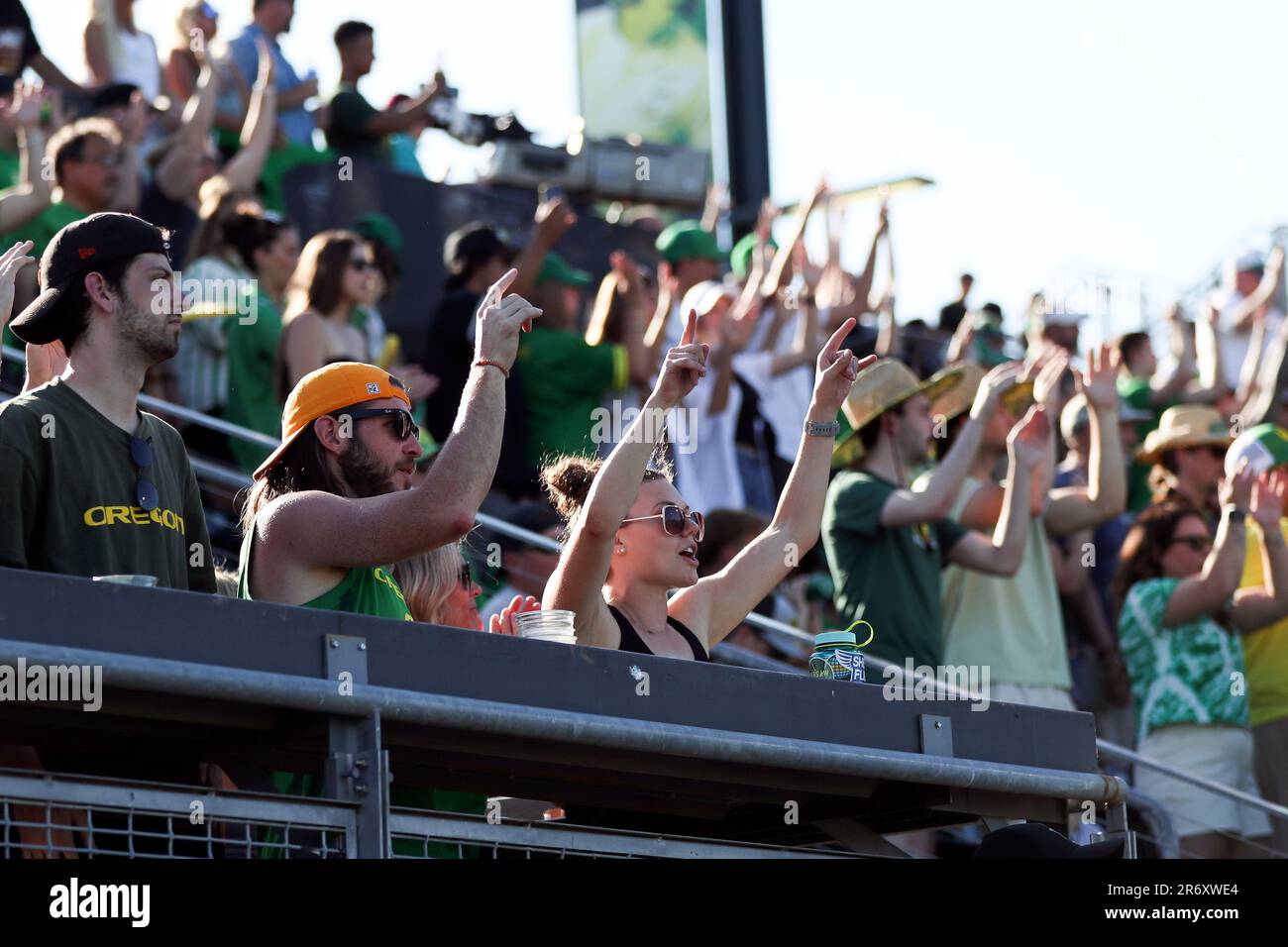 Oregon fans sing along to "Shout," during an NCAA college baseball ...