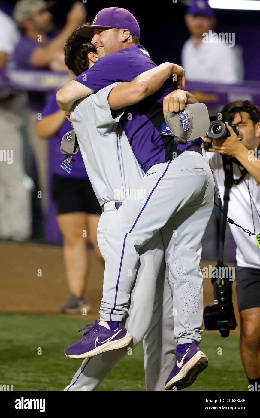 LSU pitcher Blake Money picks up head coach Jay Johnson after defeating ...