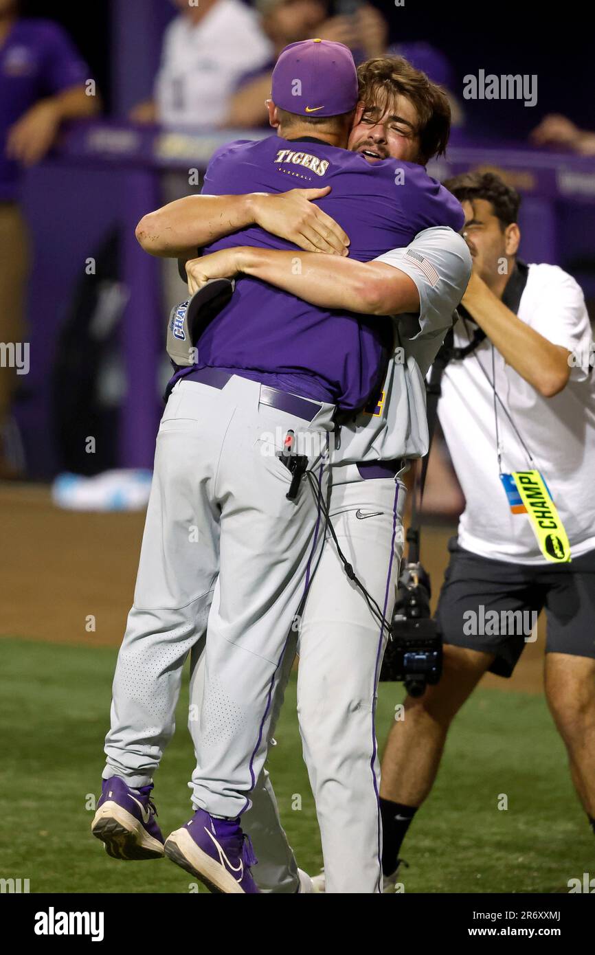 LSU pitcher Blake Money picks up head coach Jay Johnson after defeating ...