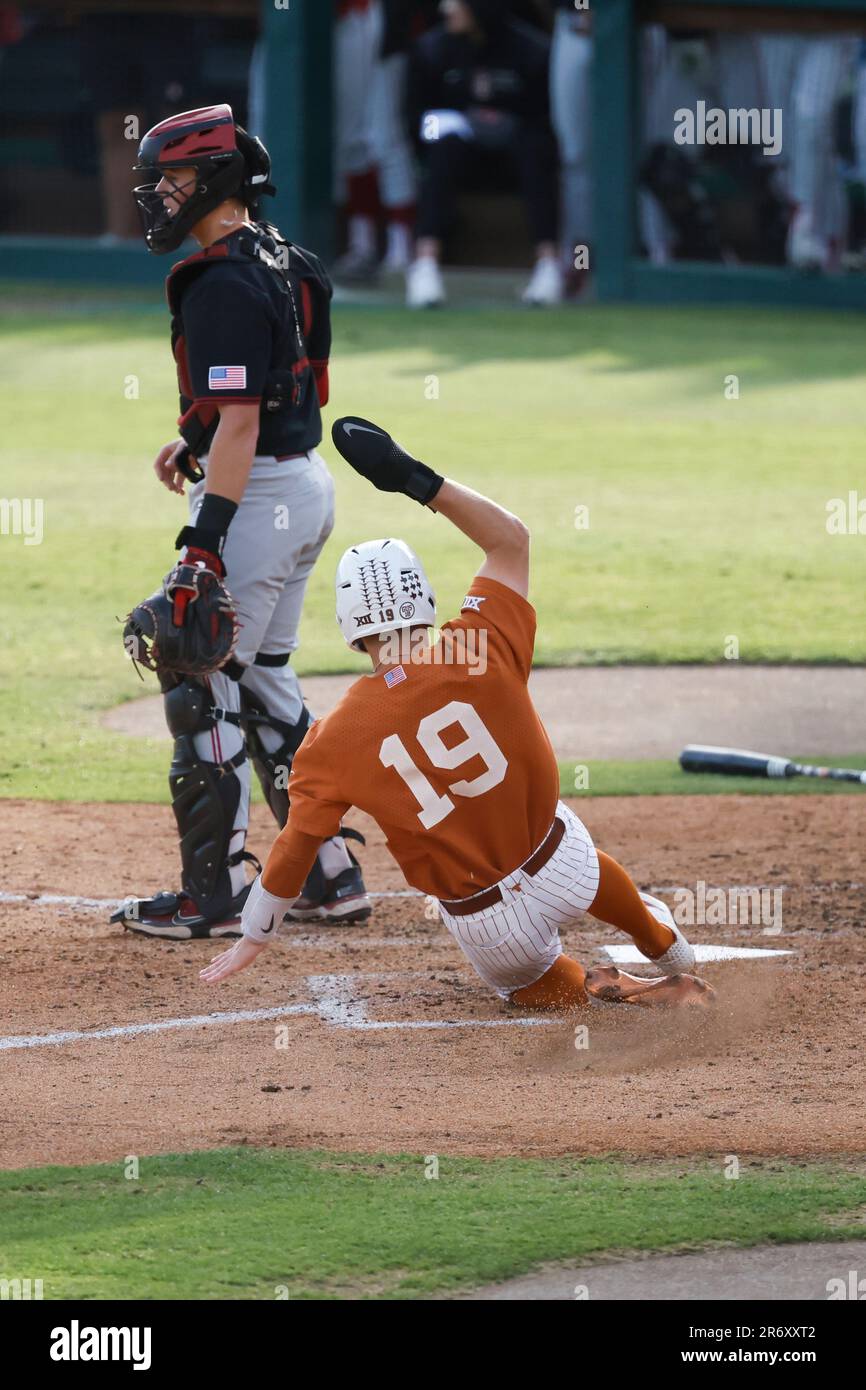 Texas infielder Mitchell Daly (19) slides in to score against Stanford ...
