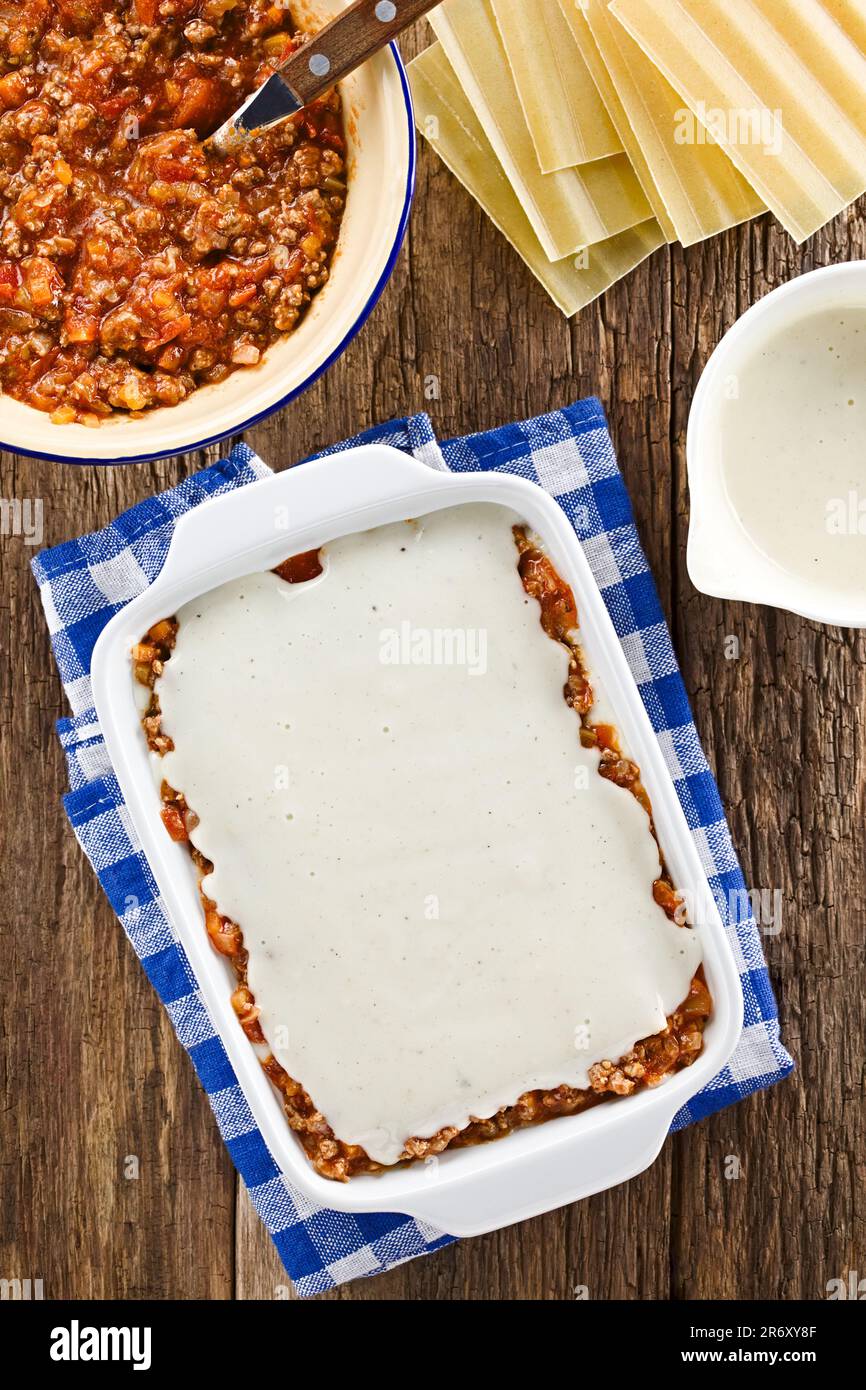 Preparing Lasagna in Rectangular Casserole Dish. Bechamel or white ...