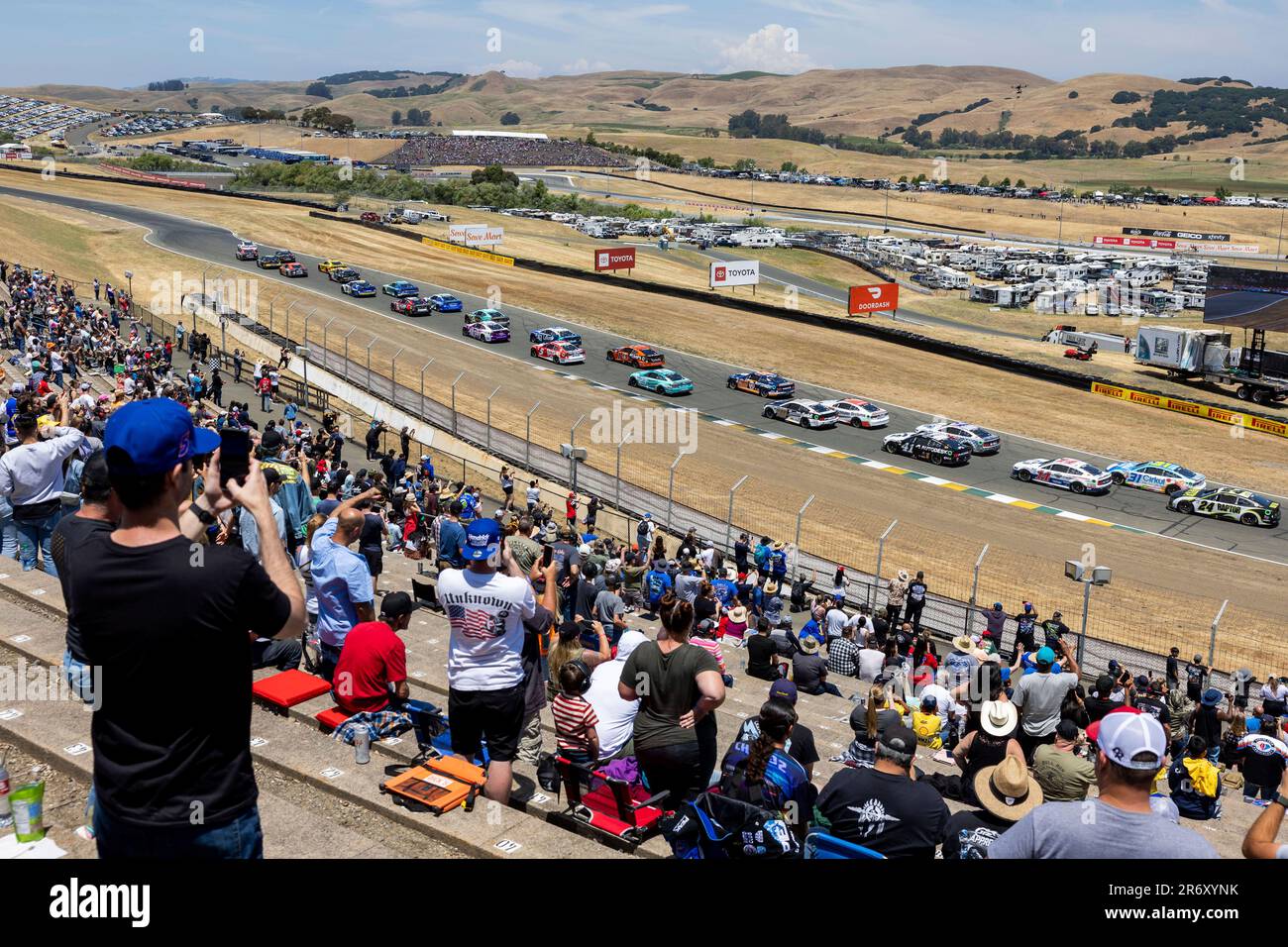 SONOMA, CA - JUNE 11: The field rounds turn 2 in view of the grandstand ...