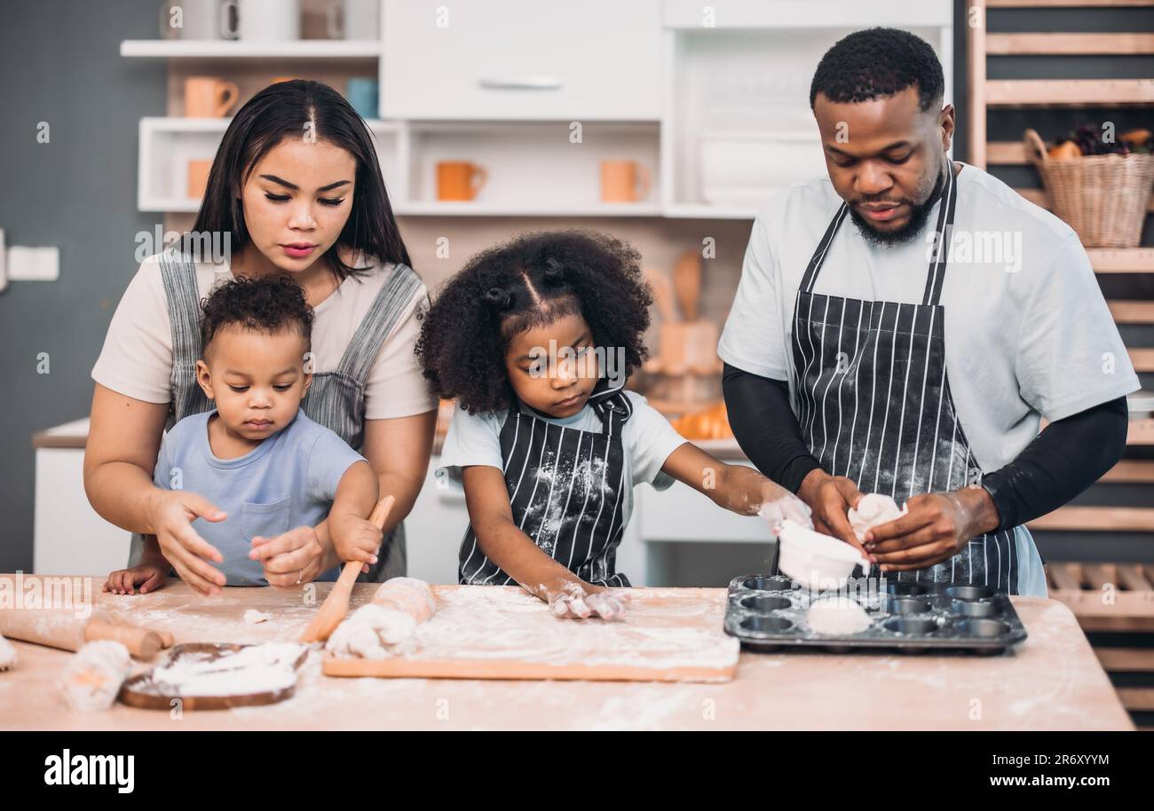 Family members cook homemade pizza dough in funny and playful ways ...