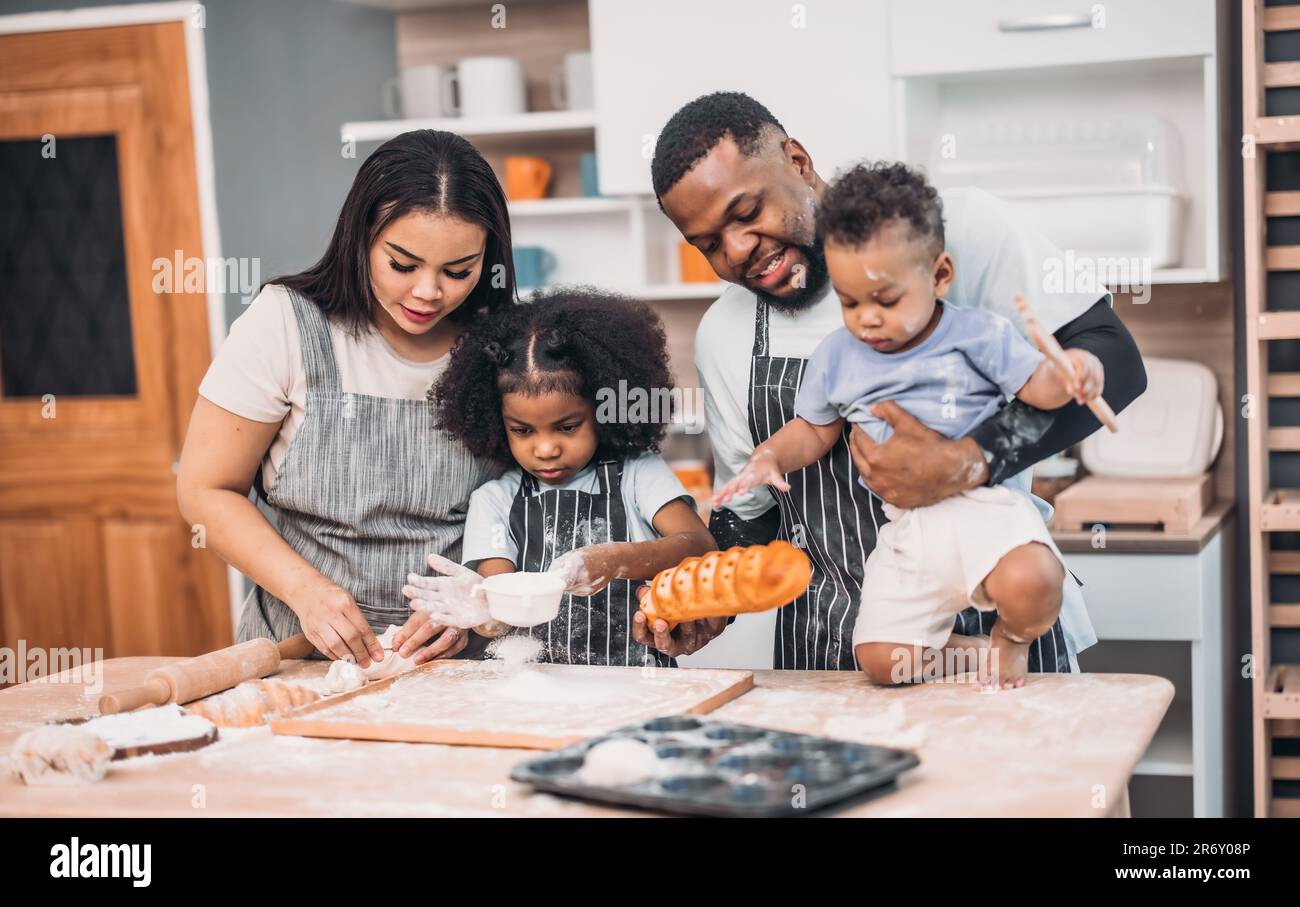 Family members cook homemade pizza dough in funny and playful ways ...