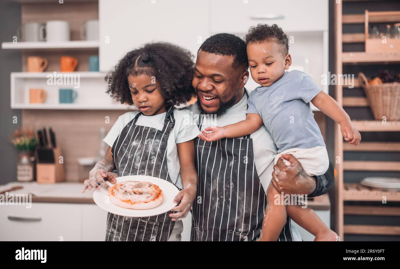 Family members cook homemade pizza dough in funny and playful ways ...