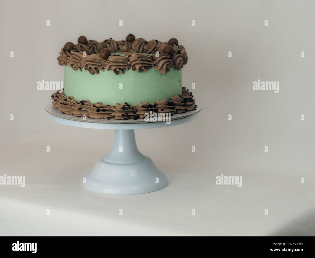 frosted icing elegnt cake with funny lettering topping. Mothers day ...