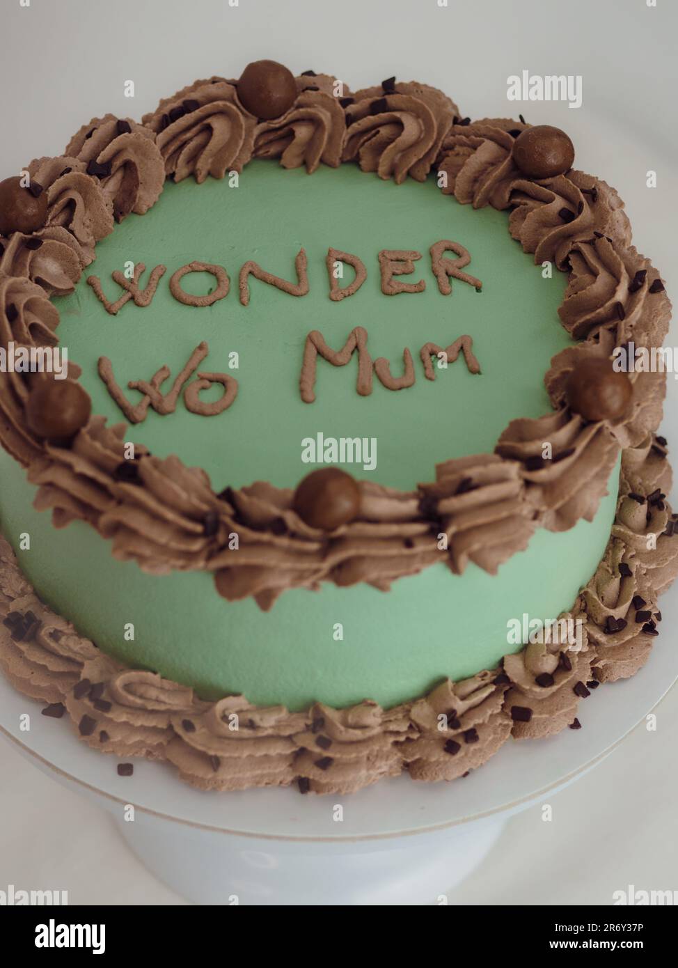 frosted icing elegnt cake with funny lettering topping. Mothers day ...