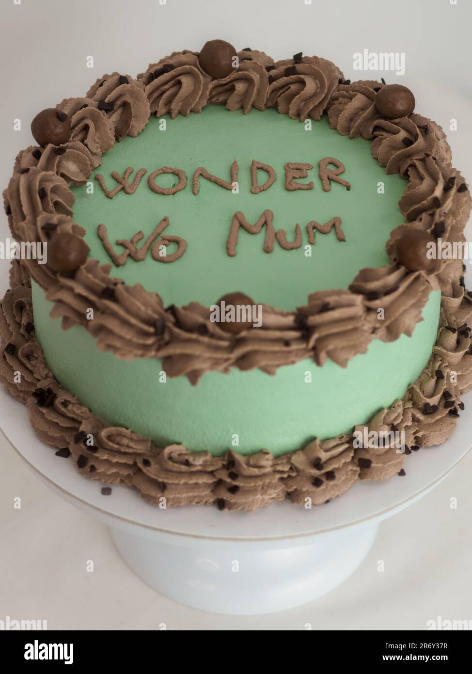 frosted icing elegnt cake with funny lettering topping. Mothers day ...