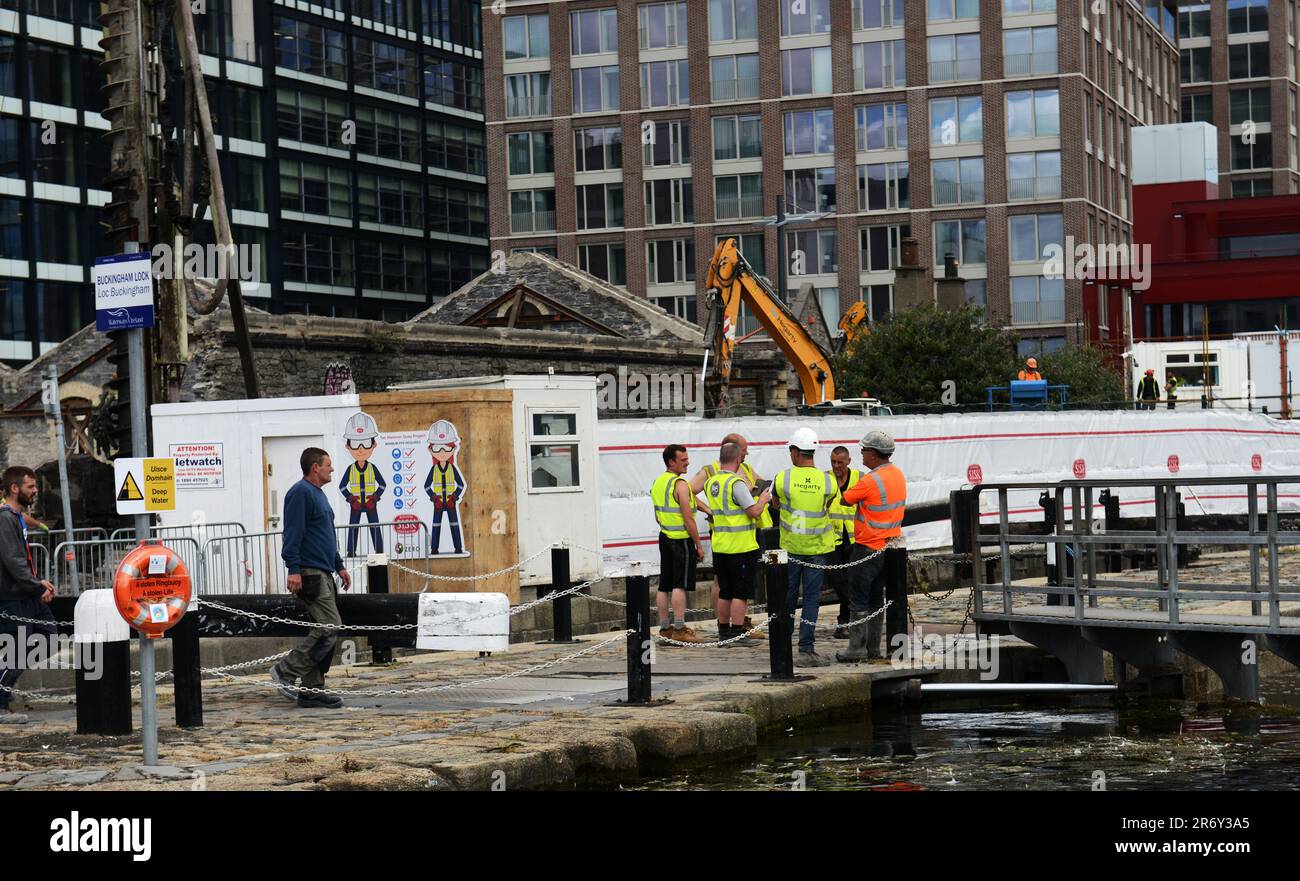 Irish construction workers working at a sight of a new building along ...