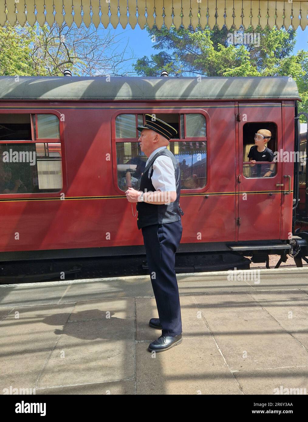Vintage train station master example Stock Photo - Alamy