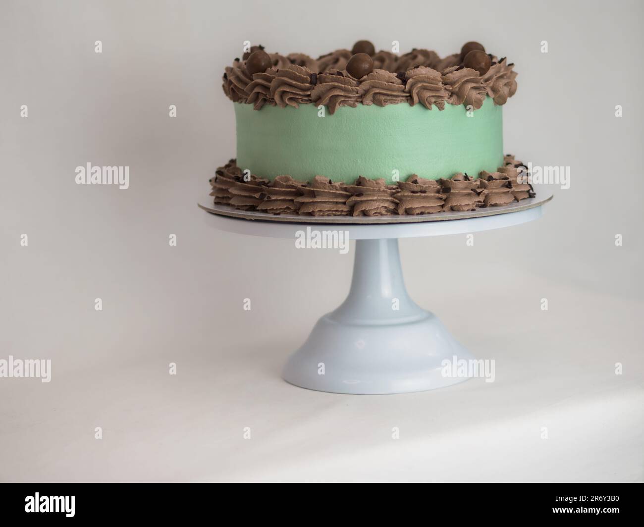 frosted icing elegnt cake with funny lettering topping. Mothers day ...