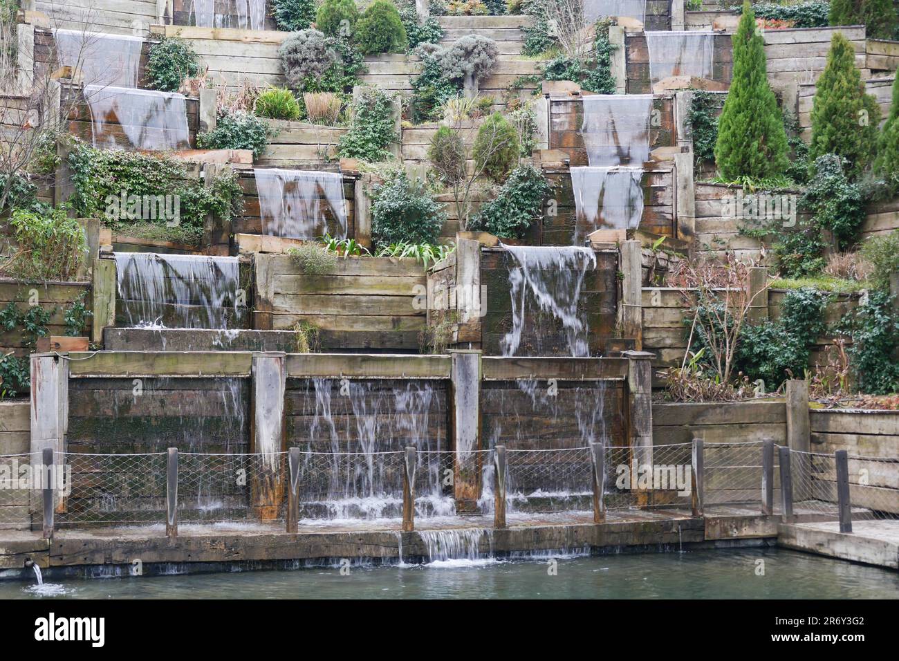 Decorative waterfall flowing from high Stock Photo - Alamy