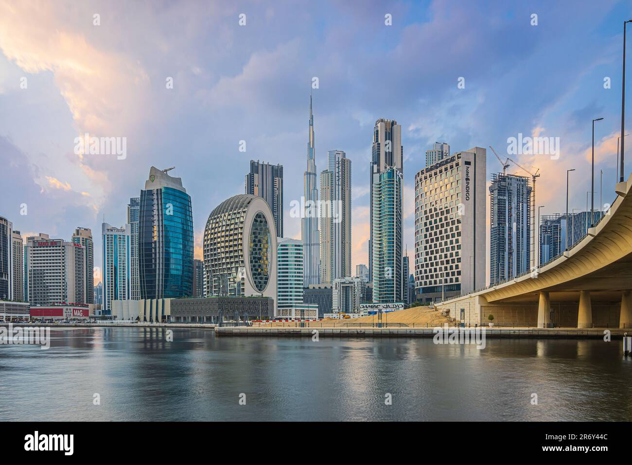 financial district of Dubai. City sunset skyline. Business center with ...