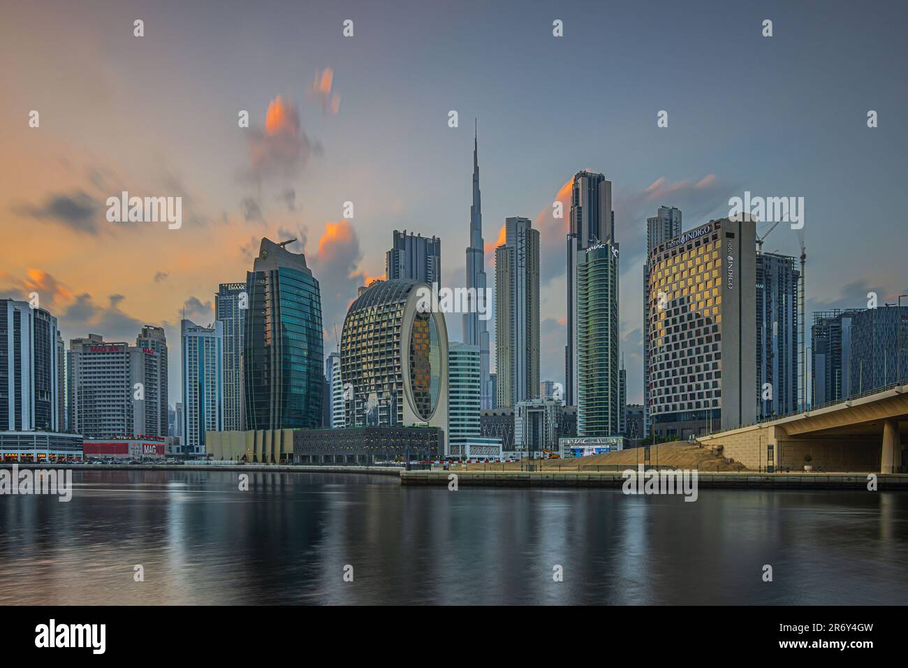 Sunset in Dubai. Evening sun with clouds over city skyline of United ...