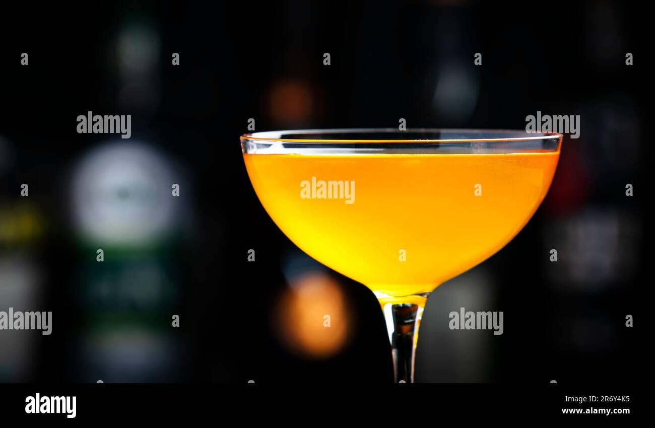 Golden alcoholic cocktail drink with whiskey, apple liqueur, ginger ...