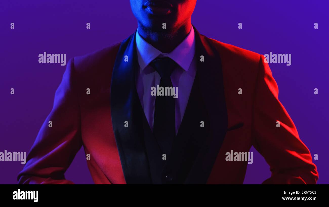 Gentleman fashion. Dandy style. Party look. Neon light unrecognizable ...