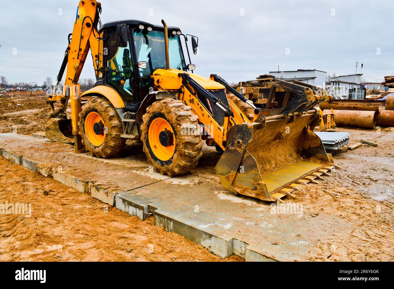 Big bright yellow powerful industrial heavy excavator tractor ...