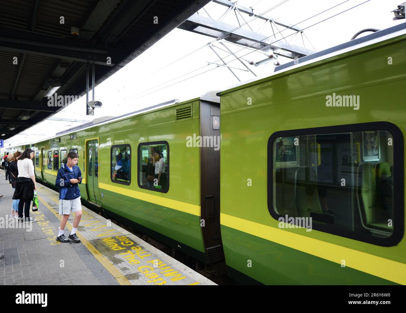 Passengers waiting for the train to Howth at the Connolly Train station in Dublin, Ireland Stock ...