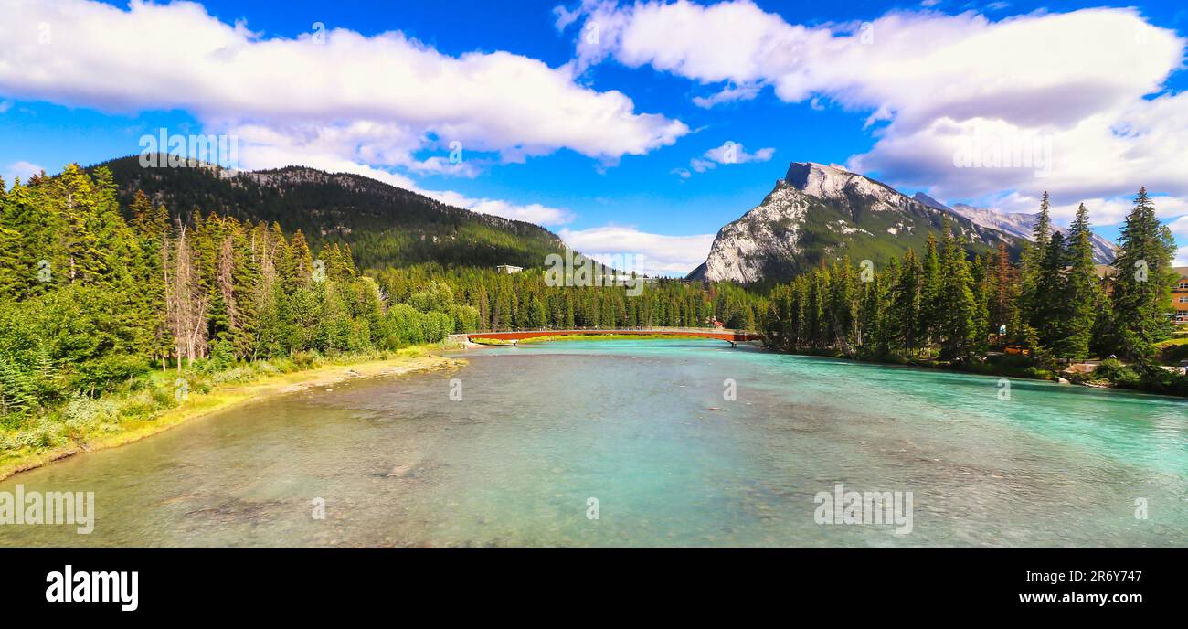 Panoramic view of the Bow River flowing between the Rundle Range and ...