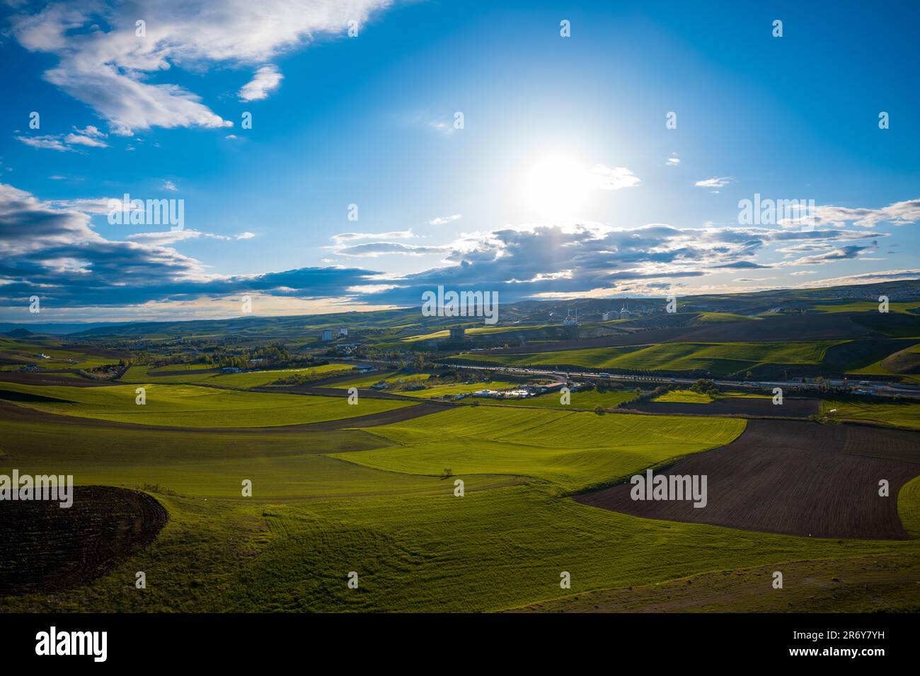 Endless Green Fields from Above with Stunning Sky and Setting Sun Stock ...