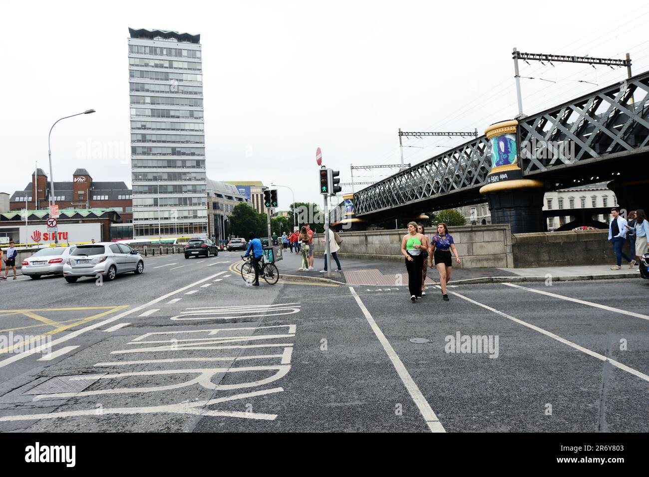Young Irish women crossing George's Quay near the Loopline bridge in ...