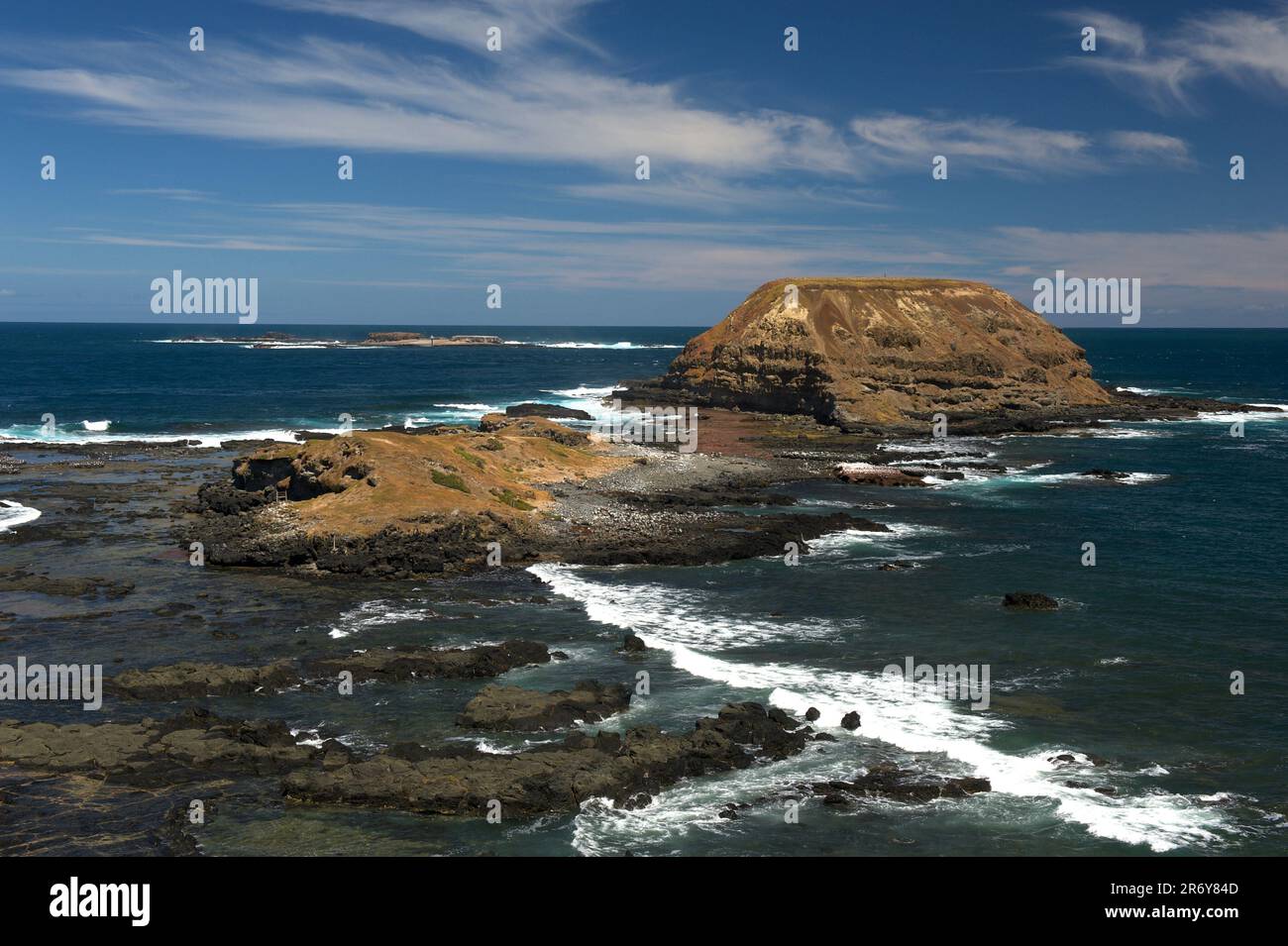 Low tide at The Nobbies shows the reef of rock, which makes this coast ...