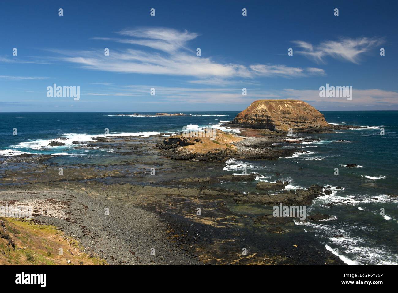 Low tide at The Nobbies shows the reef of rock, which makes this coast ...