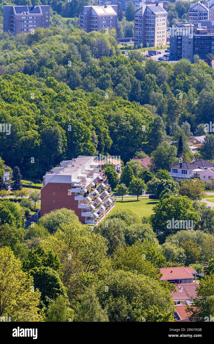 Residential houses in a city with green area and lush green trees Stock ...